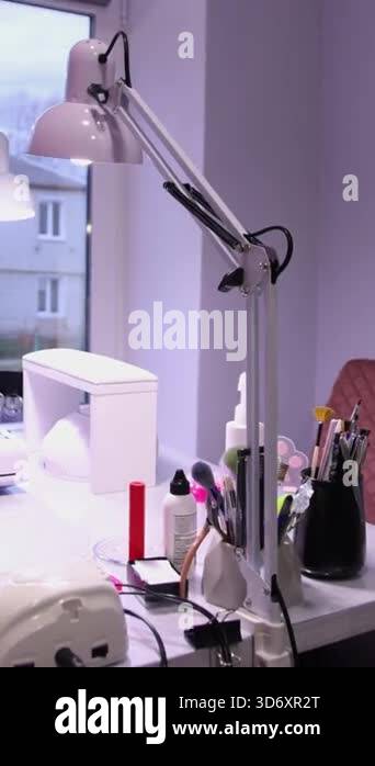 Close-up Modern Nail Salon Workplace with Manicure UV Lamp. a ...