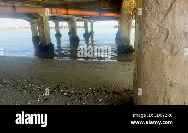 A unique perspective from underneath a concrete pier or raised ...