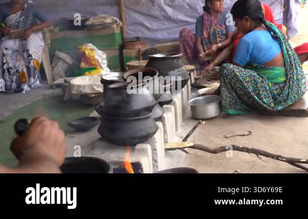 NAGPUR, MAHARASHTRA, INDIA, January 25, 2023 : Woman making and cooking ...