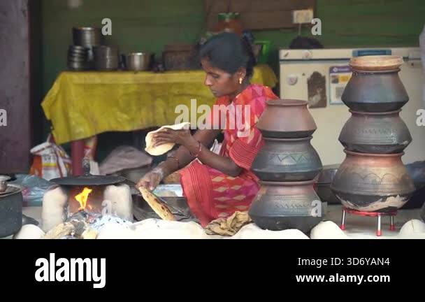 NAGPUR, MAHARASHTRA, INDIA, January 25, 2023 : Woman making and cooking ...