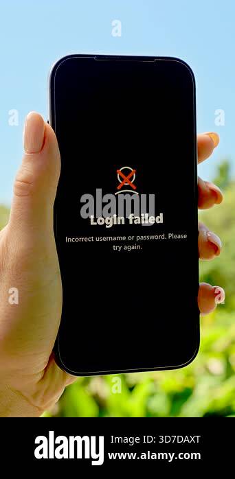 Vertical video. Smartphone in Hand Showing Login Failed Screen with ...