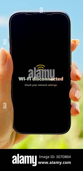 Vertical video. Smartphone in Hand Showing WiFi Disconnected Warning ...