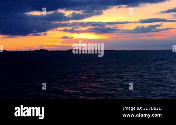 Moving Ferry During Sunset with Colorful Sky and Golden Light ...