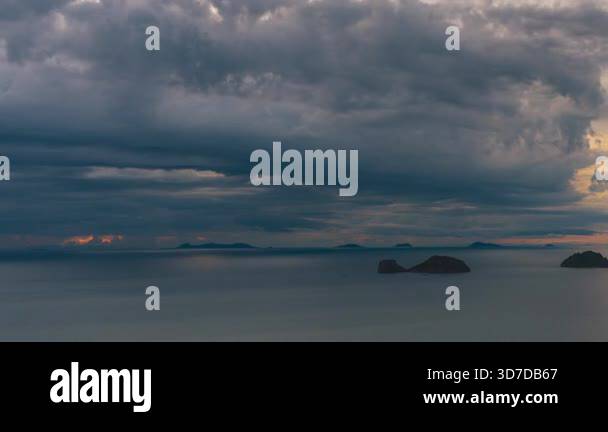 Dramatic Cloud Layers Above Ocean and Islands with Fiery Orange Glow of ...