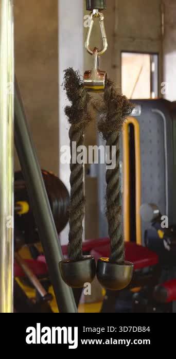 Vertical video. Close-Up of Frayed Rope Attachment Hanging from Cable ...
