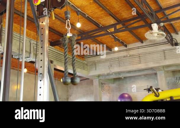 Cable Machine with Rope Attachment in Bright Industrial Gym Interior ...