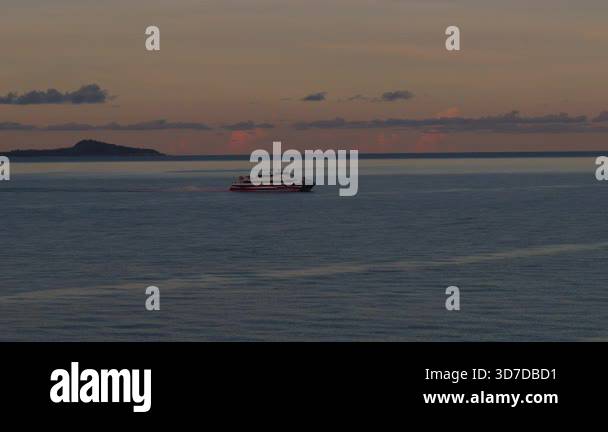 Passenger Ferry Travels Across Calm Sea Toward Distant Horizon During ...