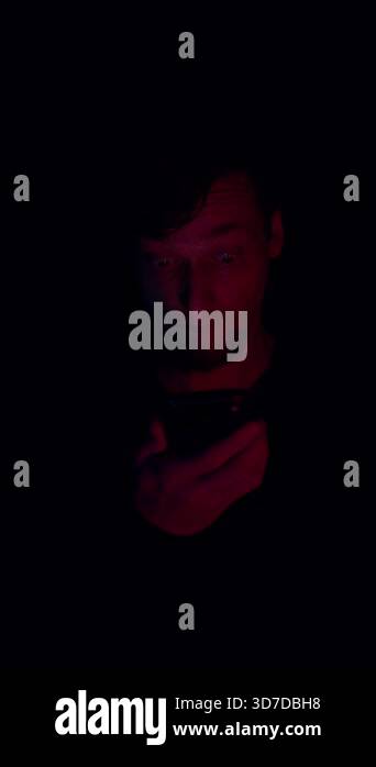 Vertical video. Hand Holds Smartphone with Scam Call Screen While User ...