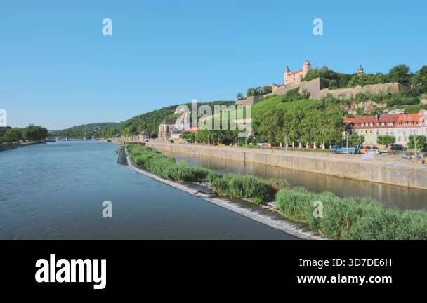 Wide-angle landscape of the Main river flowing past the Marienberg ...