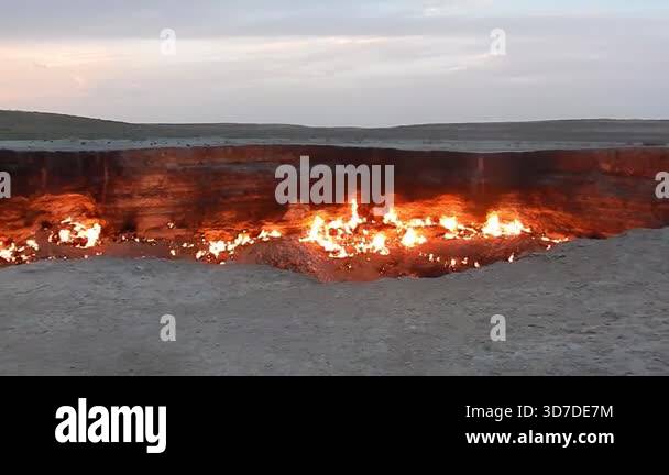 Flames of the Darvaza Gas Crater, also known as the Door to Hell, in ...
