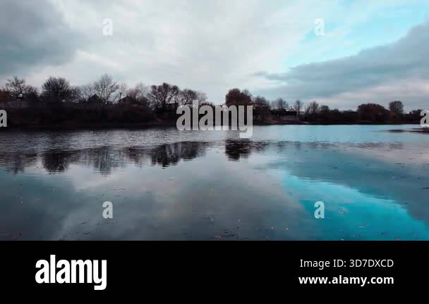 Beautiful autumn landscape with a lake and blue water. Retro-style ...