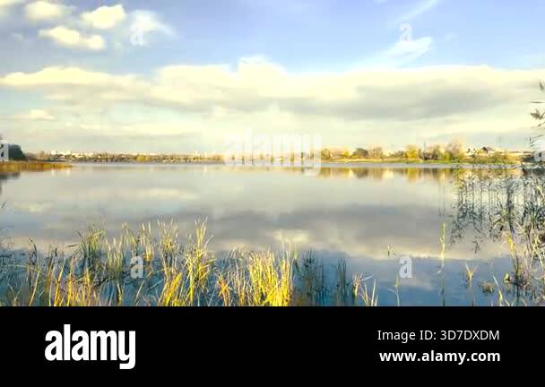 Beautiful autumn landscape with a lake and blue water. Retro-style ...