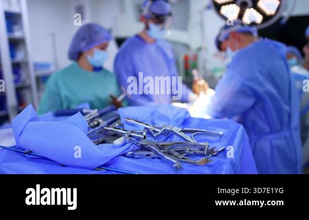 Set of metal surgical tools and devices are on the surgical stand ...