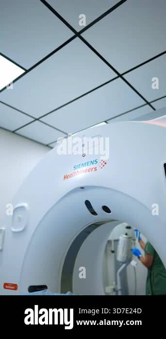 Kyiv, Ukraine, 2 August 2025: Nurse prepares the CT scanner gantry for ...