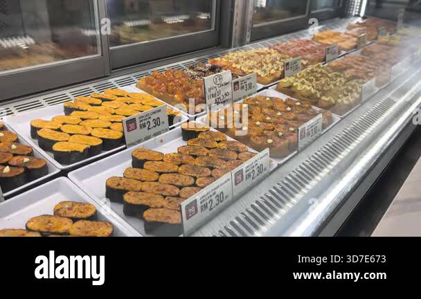 KLIA2, Malaysia -October 26, 2025: Various types of sushi are displayed ...