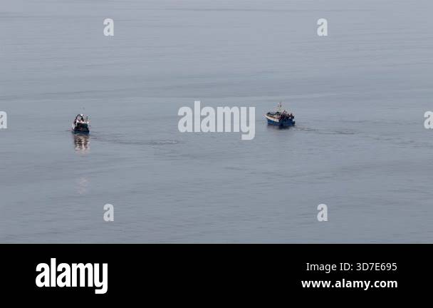 DONEGAL BAY, IRELAND - OCTOBER 11 2025 : Two trawler pulling one big ...