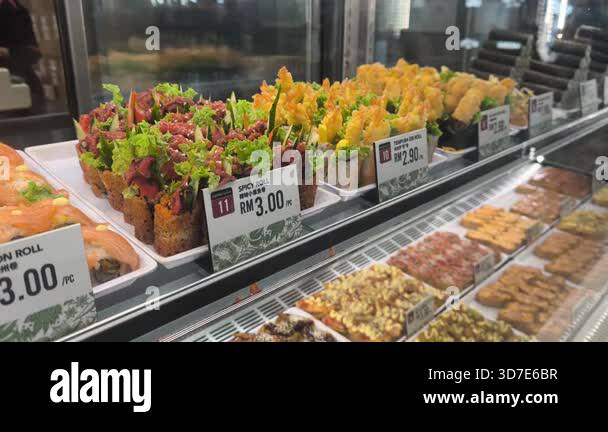 KLIA2, Malaysia -October 26, 2025: Various types of sushi are displayed ...