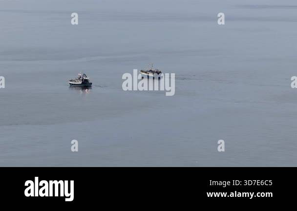DONEGAL BAY, IRELAND - OCTOBER 11 2025 : Two trawler pulling one big ...