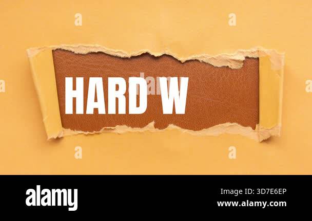 Hard Work message written on ripped torn paper background. Conceptual ...