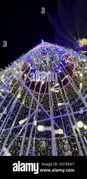 Illuminated Christmas tree structure at night Stock Video Footage - Alamy