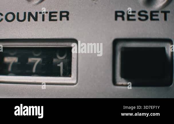 Macro shot of mechanical counter numbers advancing on a vintage silver ...