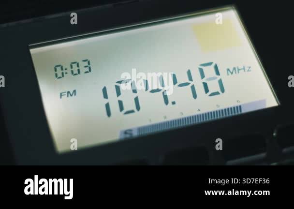 Macro shot of a digital radio tuner display scanning FM frequencies ...
