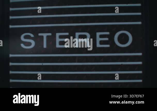 Macro close-up vintage audio device STEREO indicator light flashing red ...