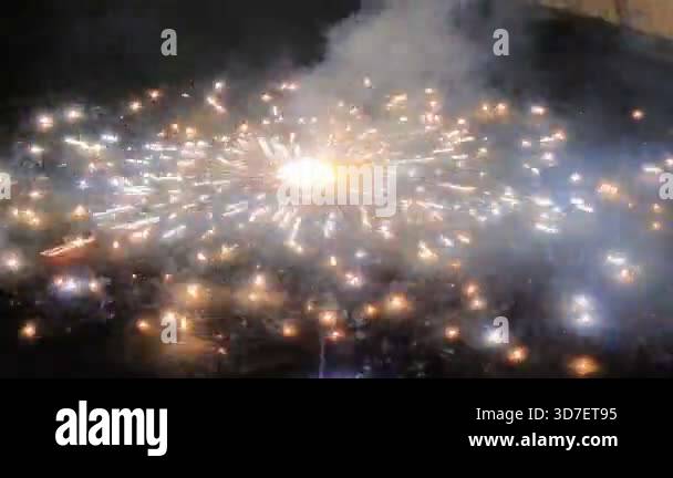 Footage of fireworks shot in the night sky as background. Close-up shot ...