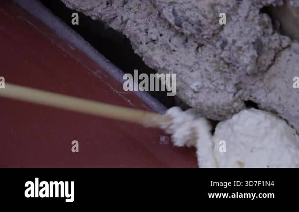 Thermal insulation material. Sealing or filling roof cracks with foam ...