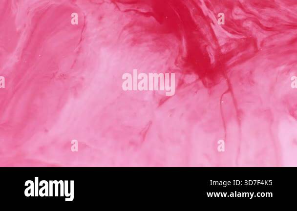 Spreading paint. Marble drip. Defocused red white water splash liquid ...