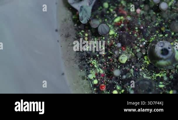 Ink bubble particles. Paint water. Defocused yellow blue colorful oil ...