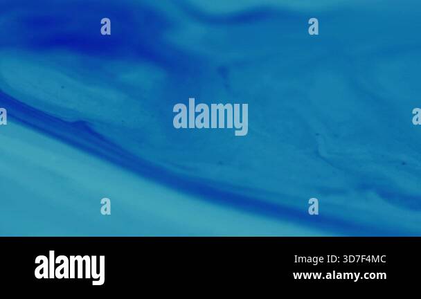 Mix color. Enamel fluid. Defocused blue white paint stream water liquid ...