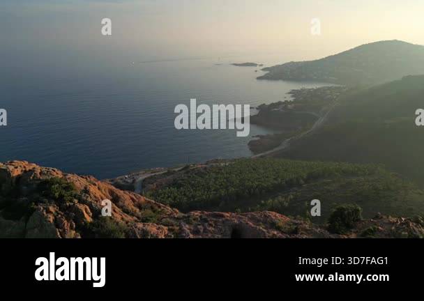 Aerial drone reveal of the Mediterranean coastline from behind the ...