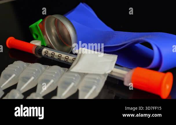 Open Harm Reduction kit supplies displays on the table. Short Injection ...