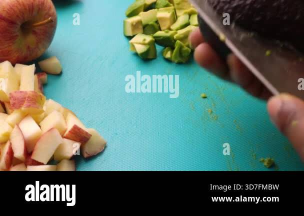 male hands chopping organic fruits on blue chopping board Stock Video ...