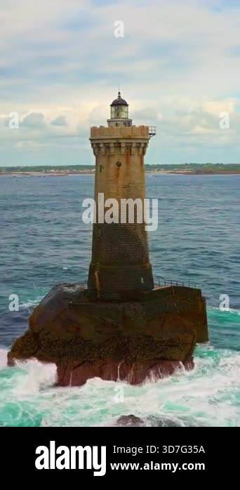 A rotating overhead shot of Phare du Four a lighthouse in Bretagne ...