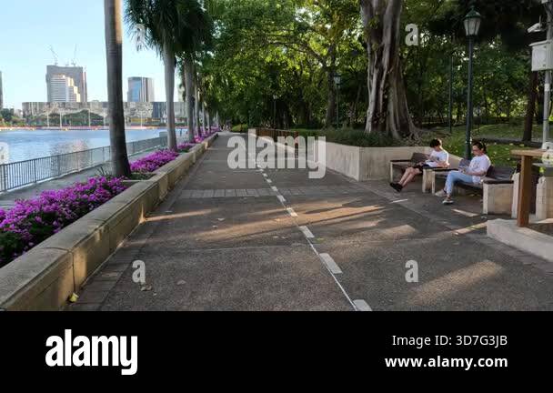 Jogger runs past people sitting Stock Videos & Footage - HD and 4K ...