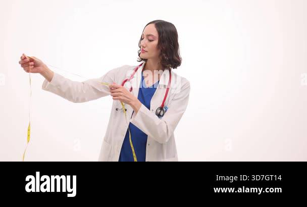 A health care professional skillfully demonstrates how to measure ...