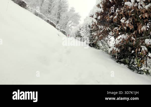 Man walking a snow path during winter in cold snowy weather Stock Video ...