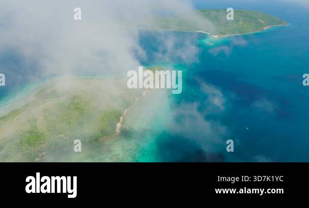 Logbon Island and Alad Island covered by scenic fogs. Turquoise water ...