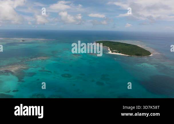 Aerial view of island coastline with white sand beach and shallow reef ...
