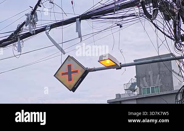 Traffic signage and messy, tangled communication wires creating visual ...