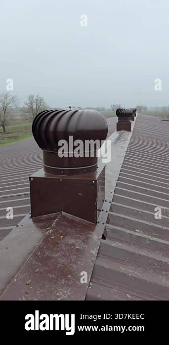 Turbo ventilator deflectors on the metal roof of an industrial building ...
