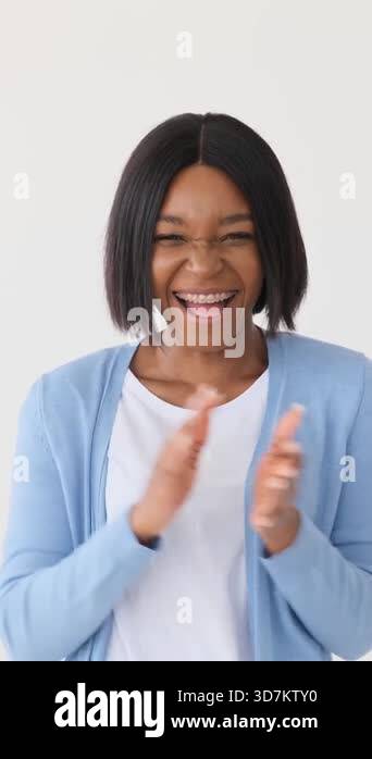 Portrait of a cheerful young African American woman with braces ...
