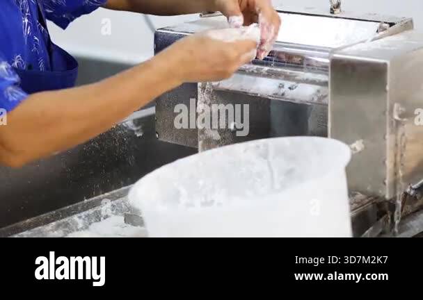 Person kneading and stretching dough on machine Stock Video Footage - Alamy