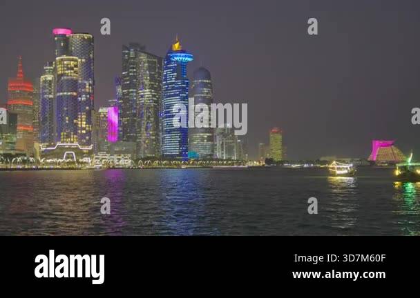 Doha, Qatar-October 21 2025: Doha skyline at night from the corniche ...