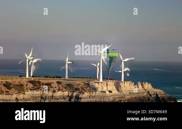 Wind Turbines on a Coastal Cliff Overlooking the Ocean wind farm ...