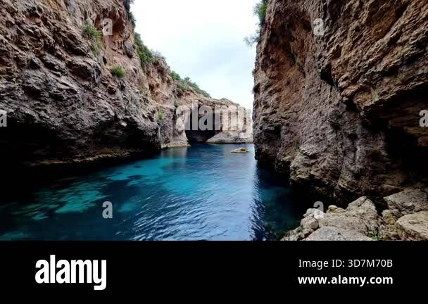 Narrow Sea Gorge with Deep Blue Water and Rocky Walls ocean canyon ...