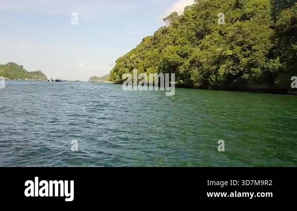 Travel to a remote tropical island. Journey through crystal-clear ...
