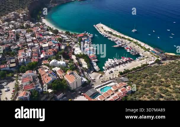 Bright blue bay with moored yachts and beach coastline in 4K Stock ...
